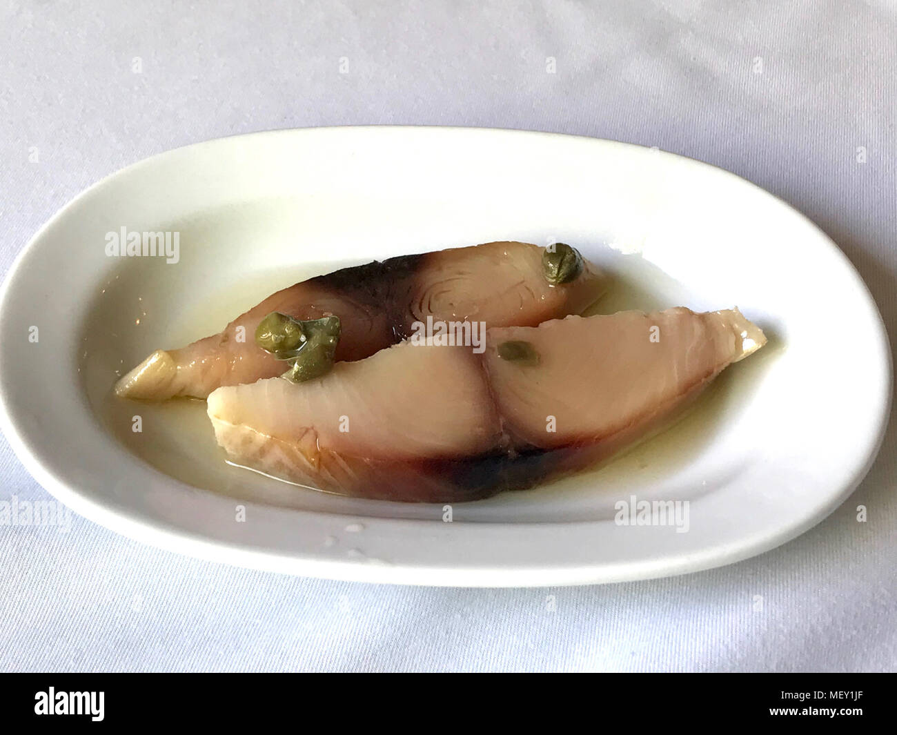 Turkish appetizer Pickled Tunny Fish with Olive Oil. Traditional ...