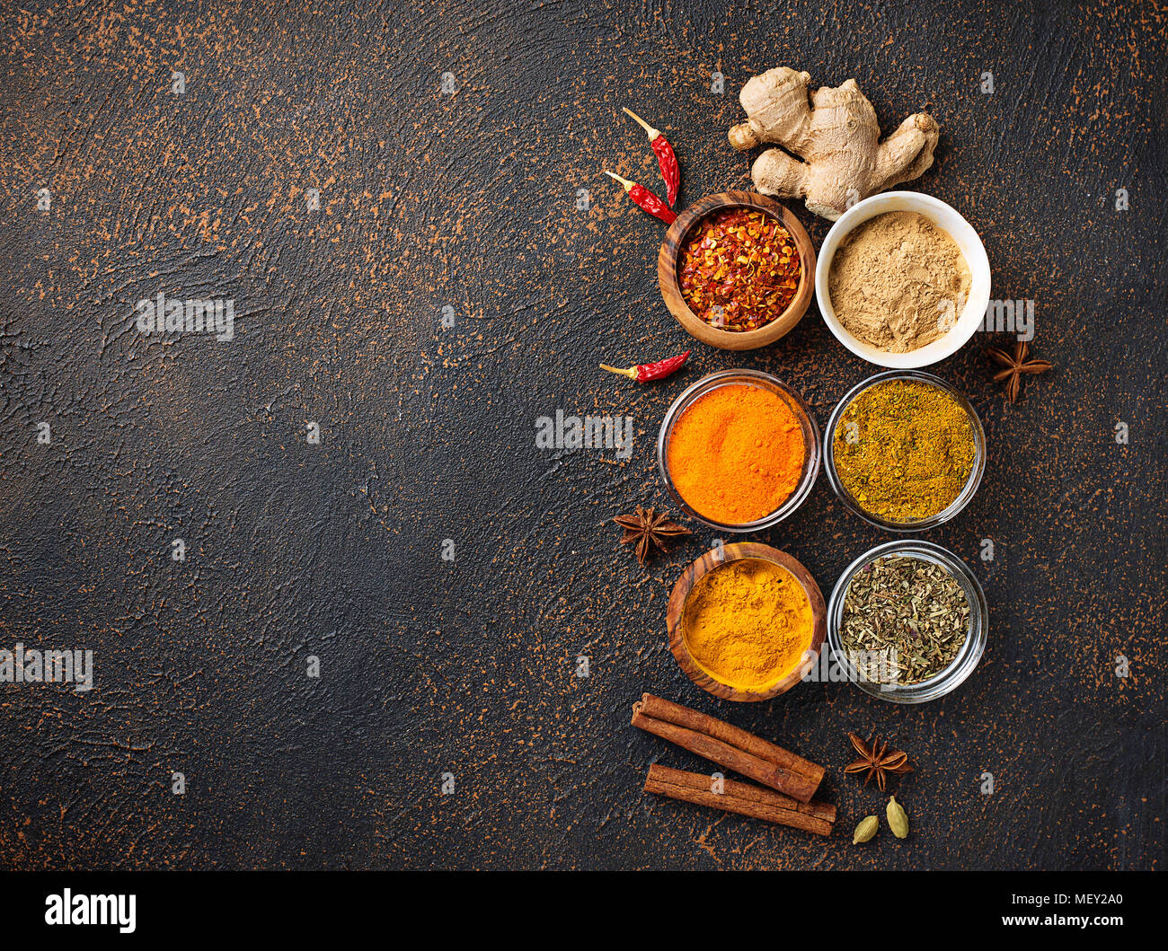 Traditional Indian spices on rusty background Stock Photo - Alamy