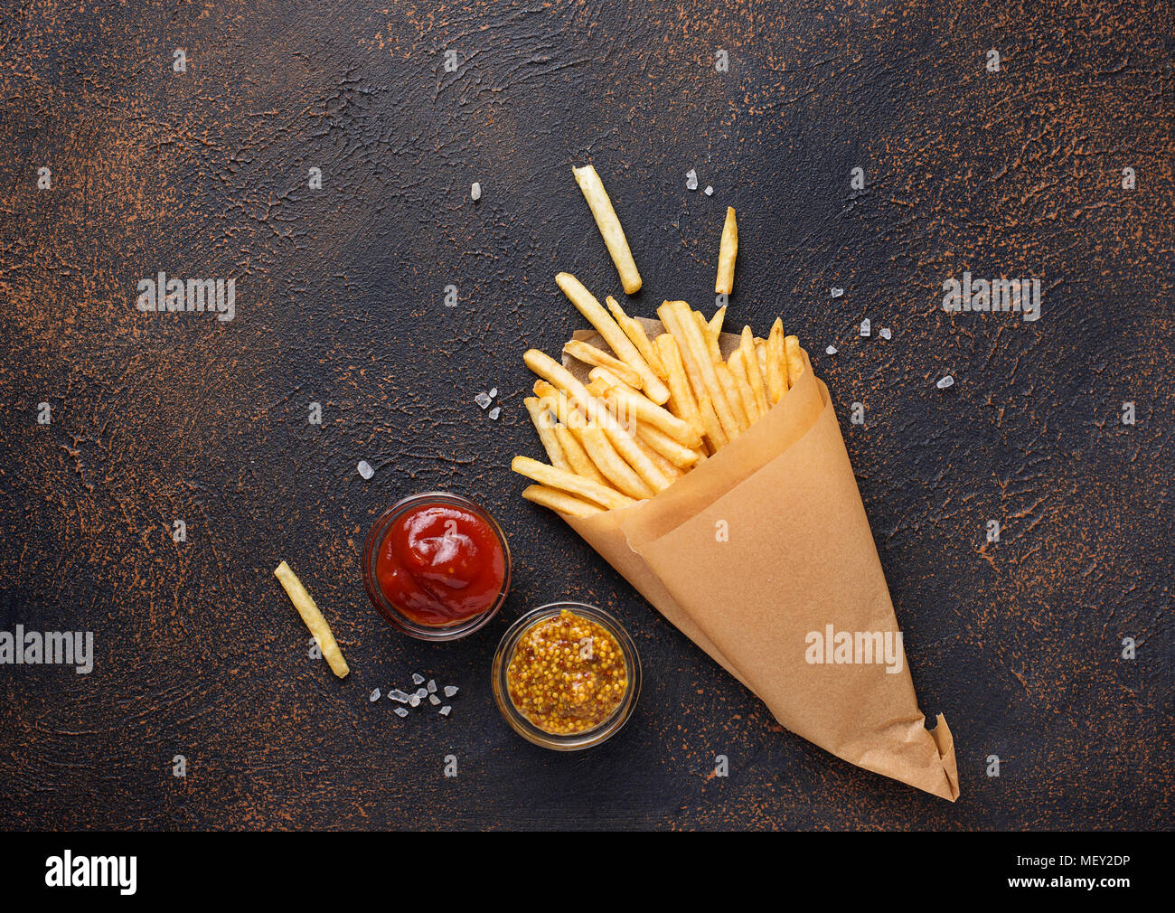 French fries in a paper bag with sauces Stock Photo - Alamy