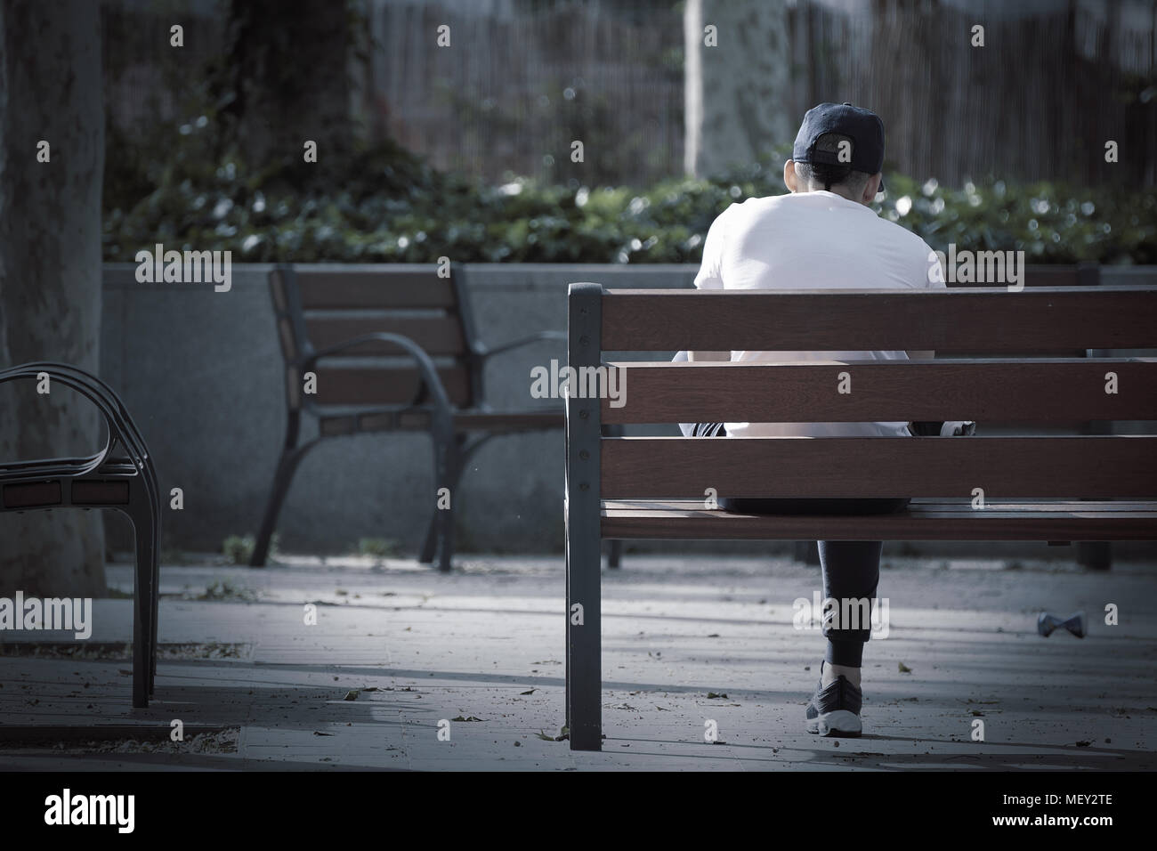 Depressed man sitting in empty hi-res stock photography and images - Alamy
