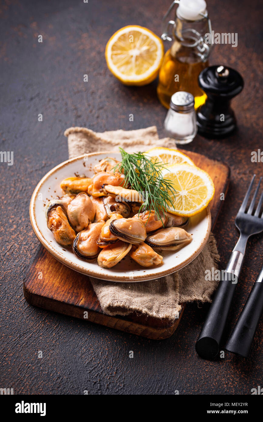 Marinated mussels with lemon and spices Stock Photo - Alamy