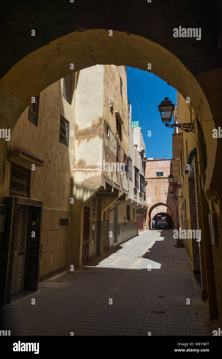 Narrow street in medina of medieval imperial city of Meknes. Morocco ...