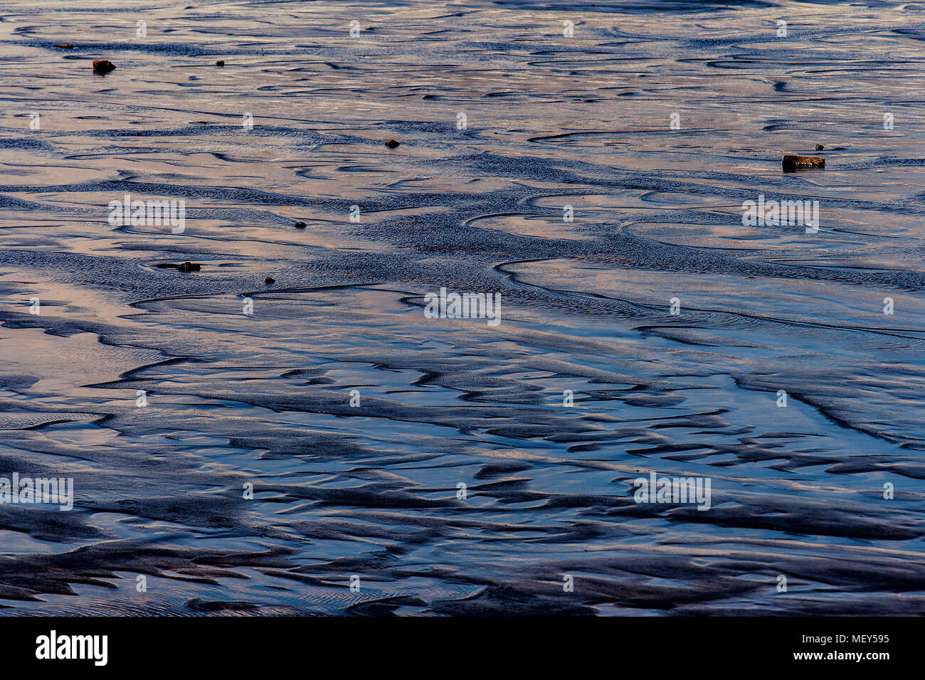 Icelandic lava sand beach with abstract patterns Stock Photo - Alamy