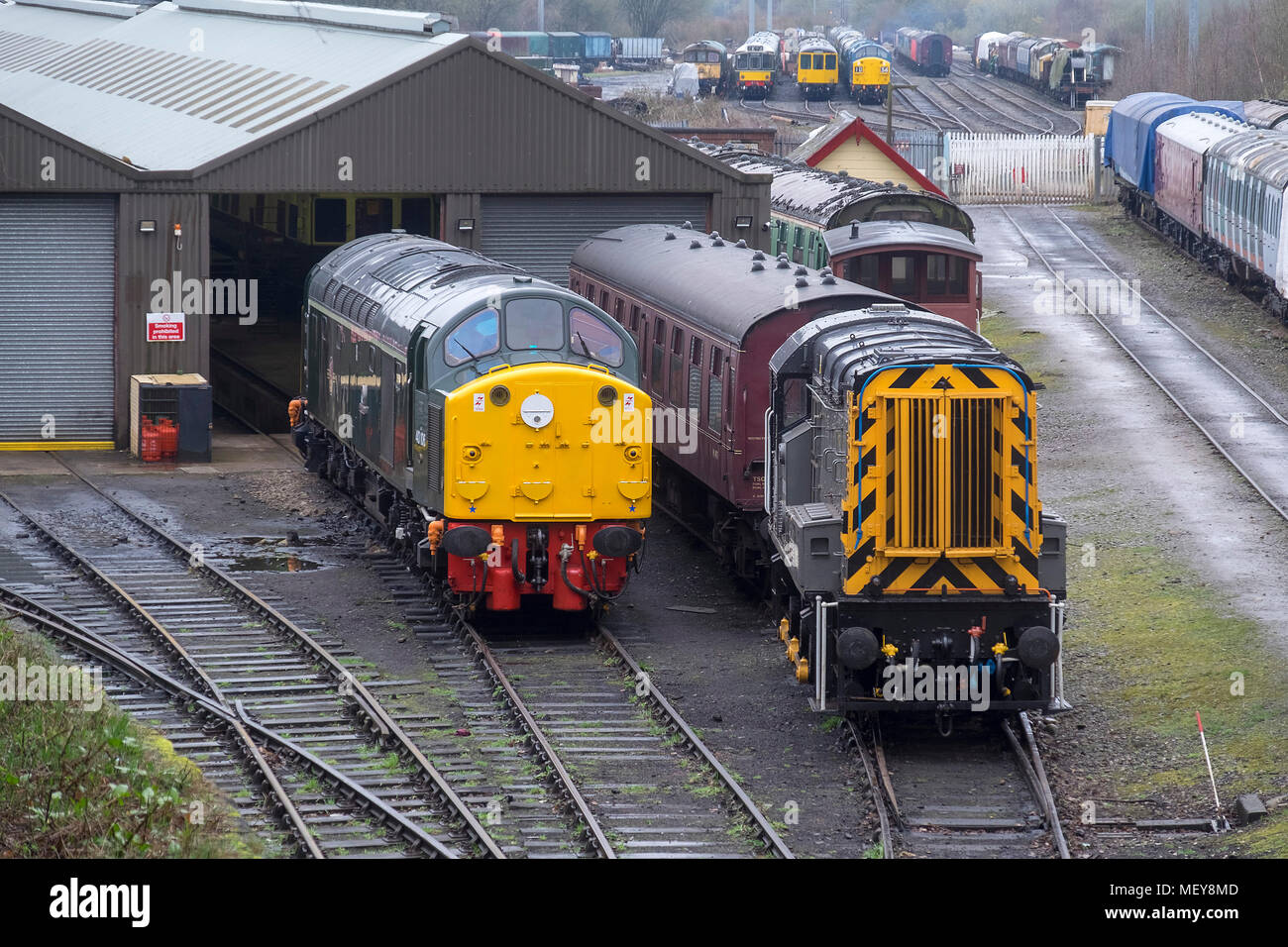 Diesel engine pulls passenger train Stock Photo - Alamy