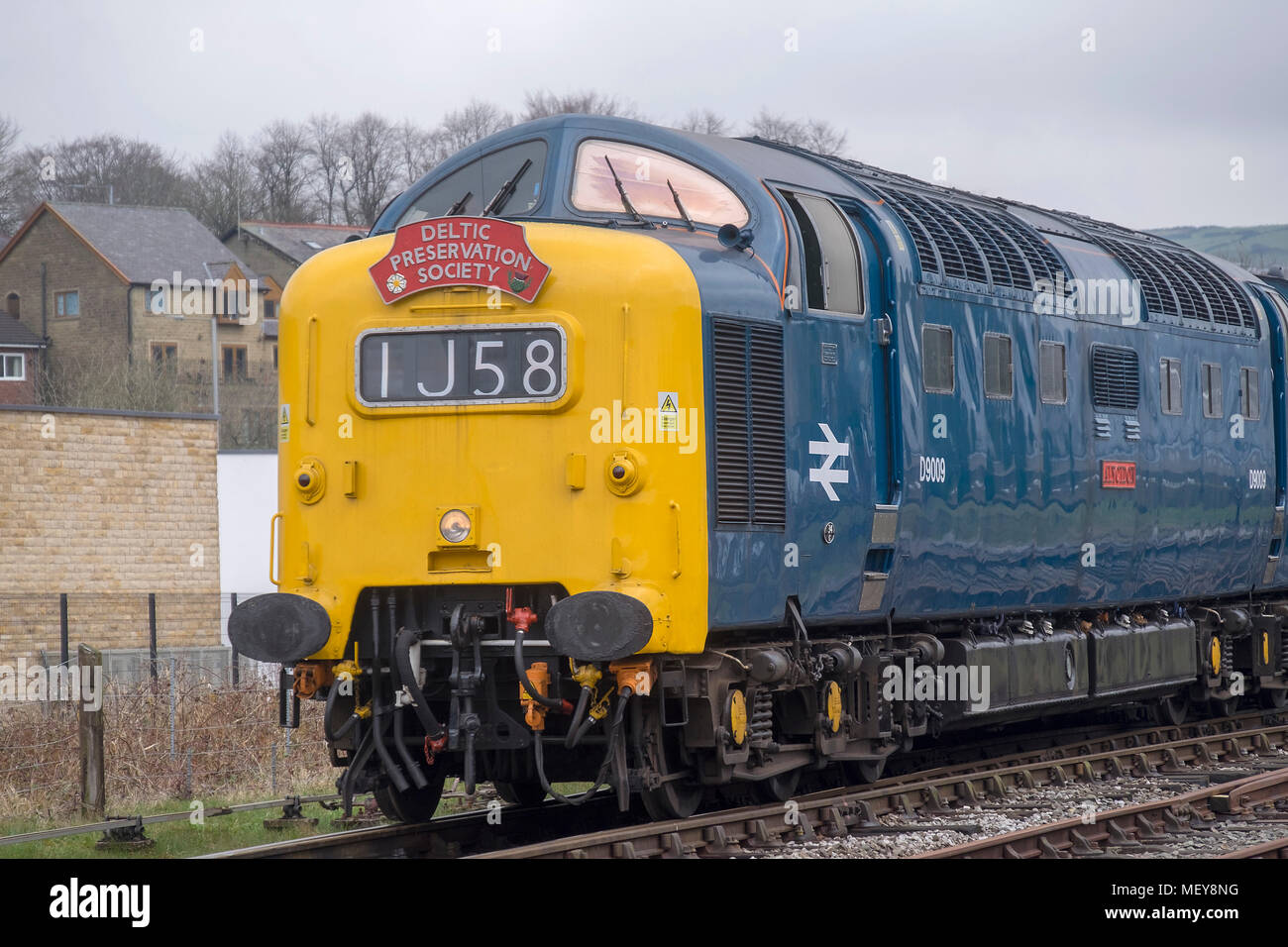 Diesel engine pulls passenger train Stock Photo - Alamy