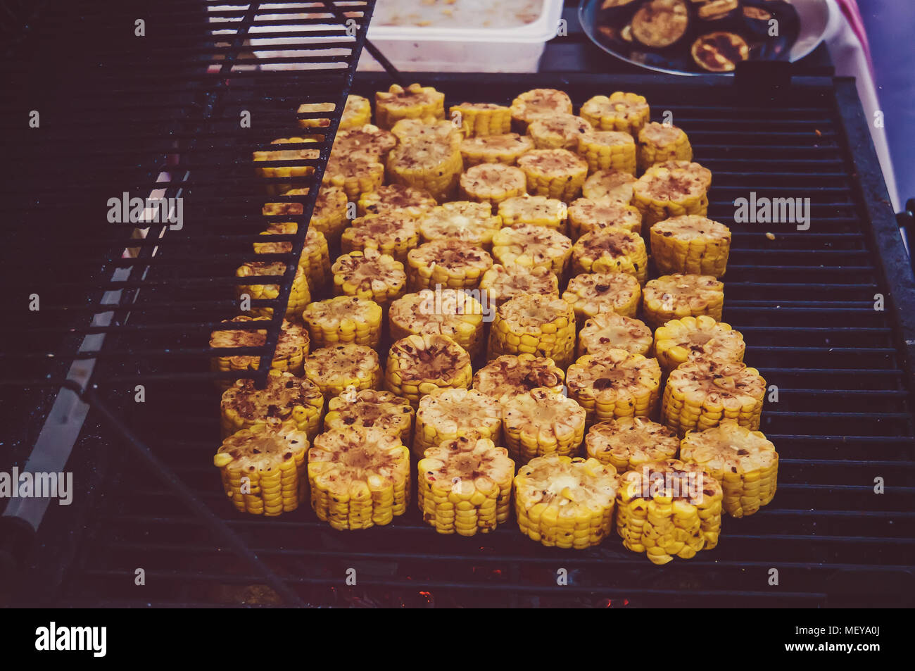Grilled corn, vegetables grilled corn on the hot stove. Burning red ...