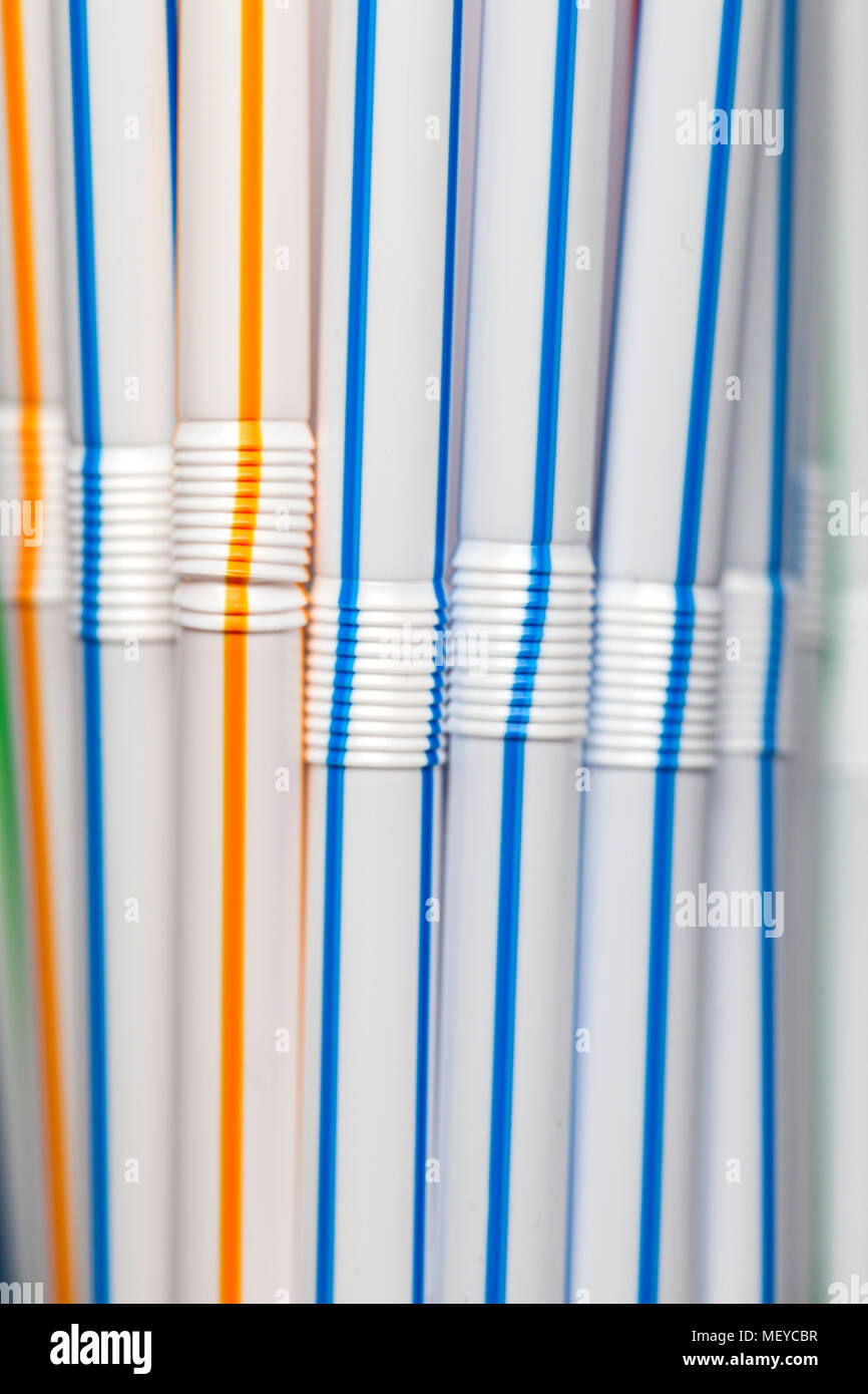 Plastic straws background Stock Photo - Alamy