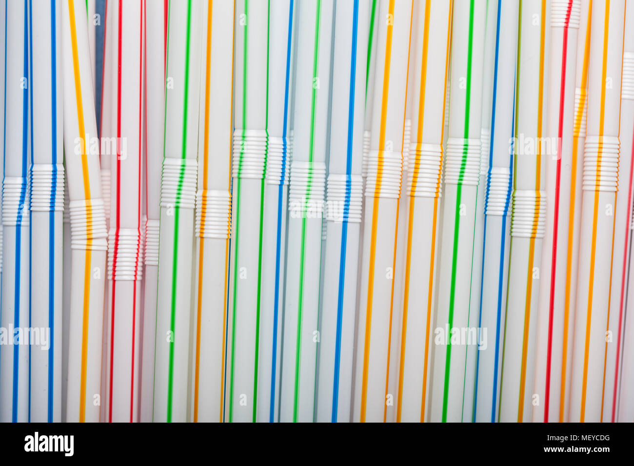 Plastic straws background Stock Photo - Alamy