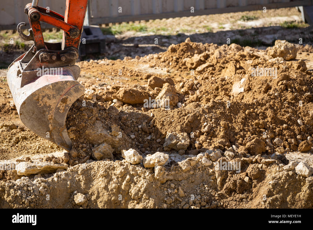 Close-up of excavator working on construction site Stock Photo - Alamy