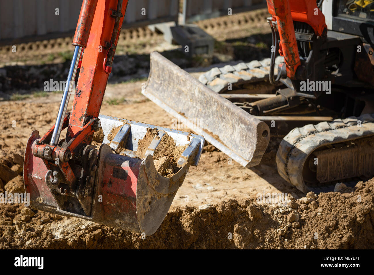 Close-up of excavator working on construction site Stock Photo - Alamy