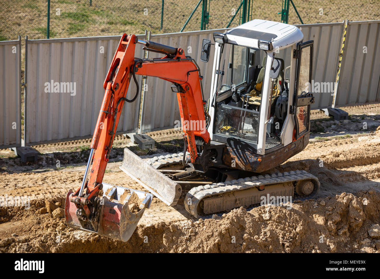Excavator working on construction site Stock Photo - Alamy