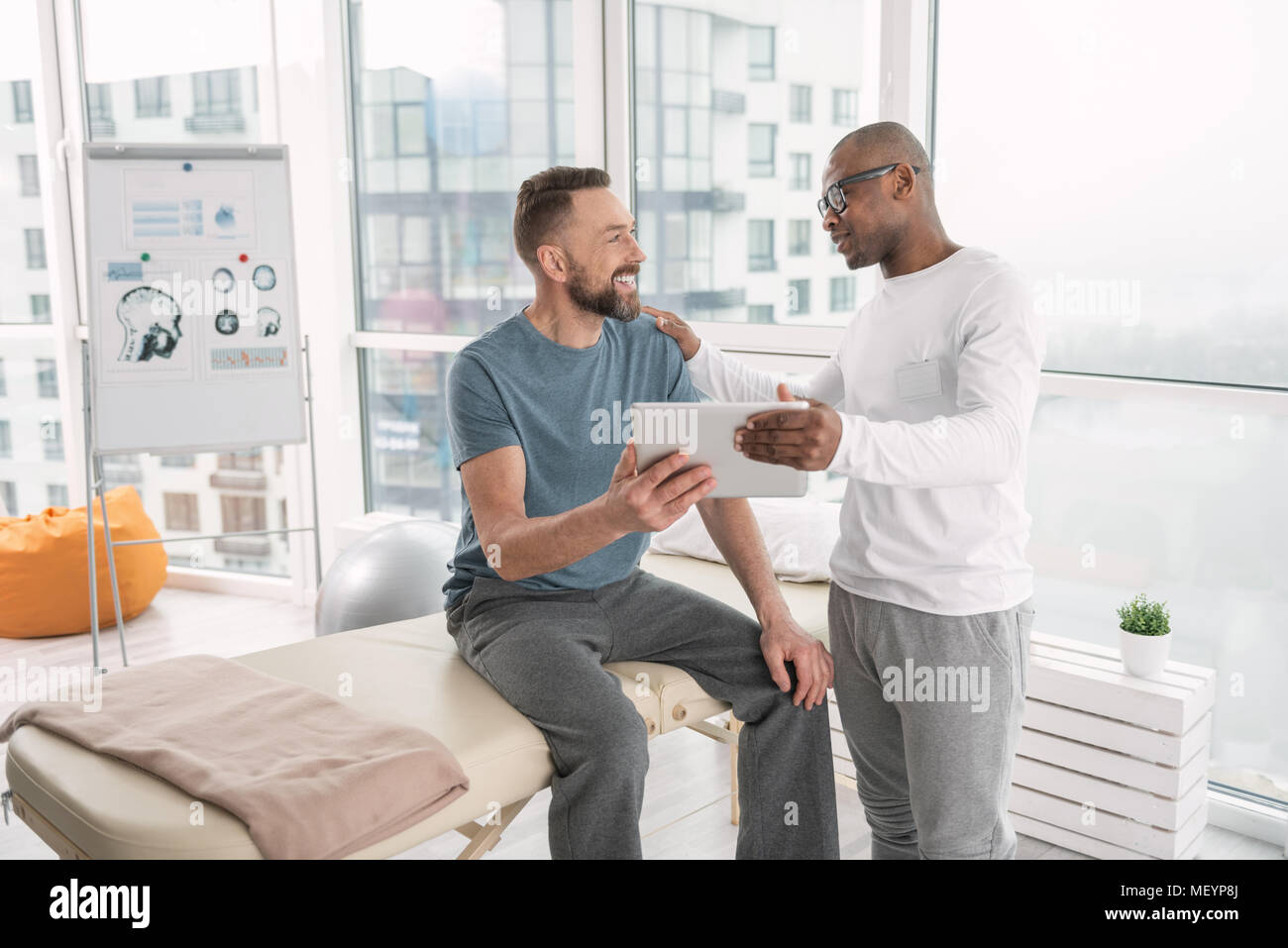 Cheerful nice man smiling Stock Photo - Alamy