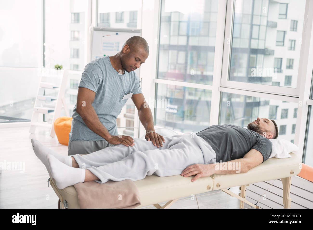 Man doing leg massage hi-res stock photography and images - Alamy