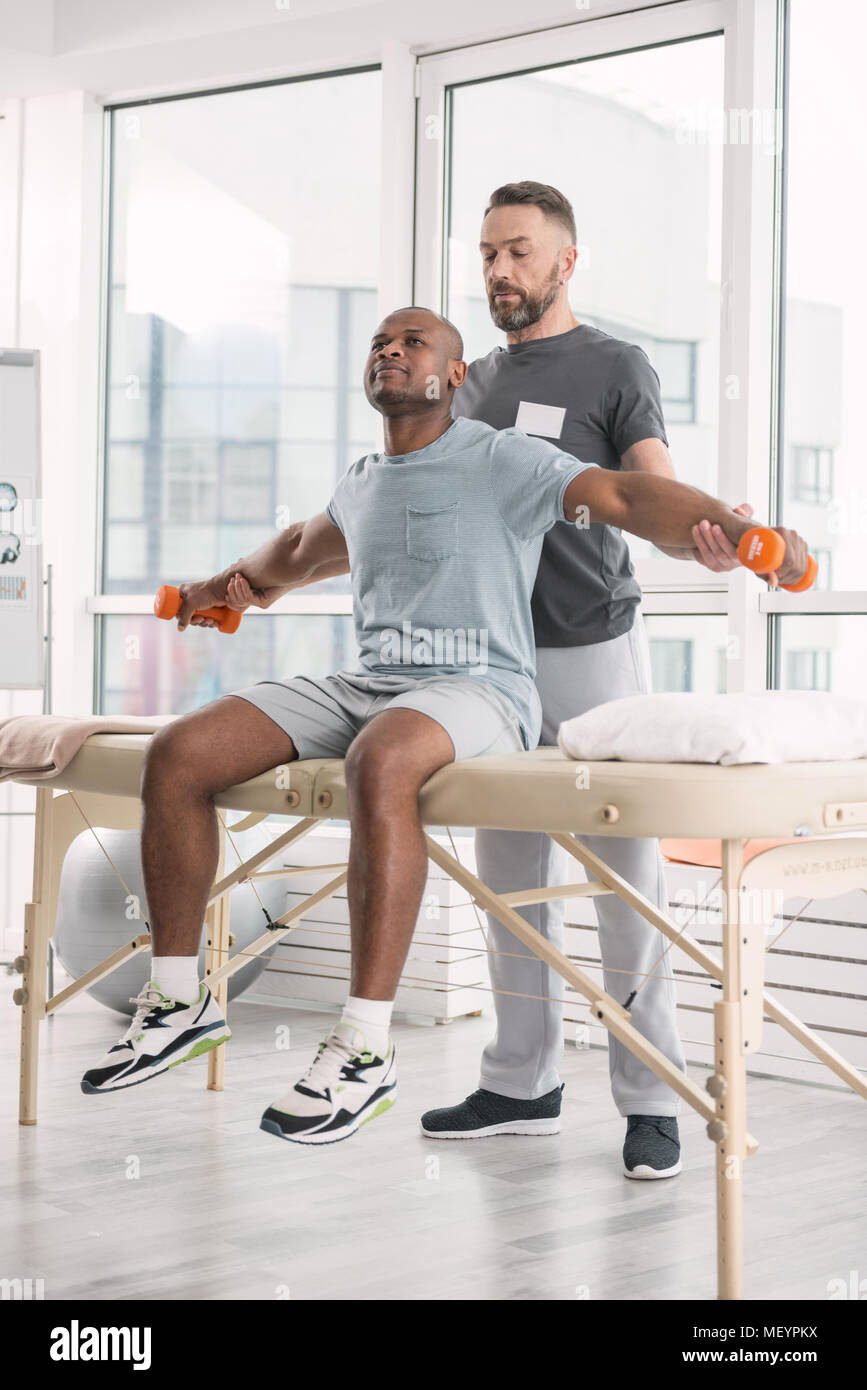 Professional male coach having a workout Stock Photo - Alamy