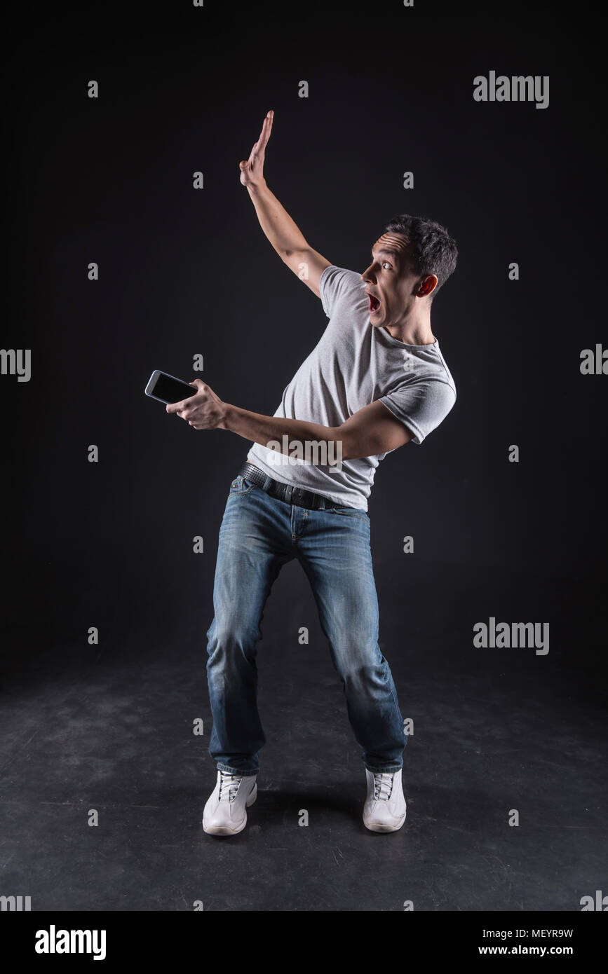 Nice young man feeling fear Stock Photo - Alamy