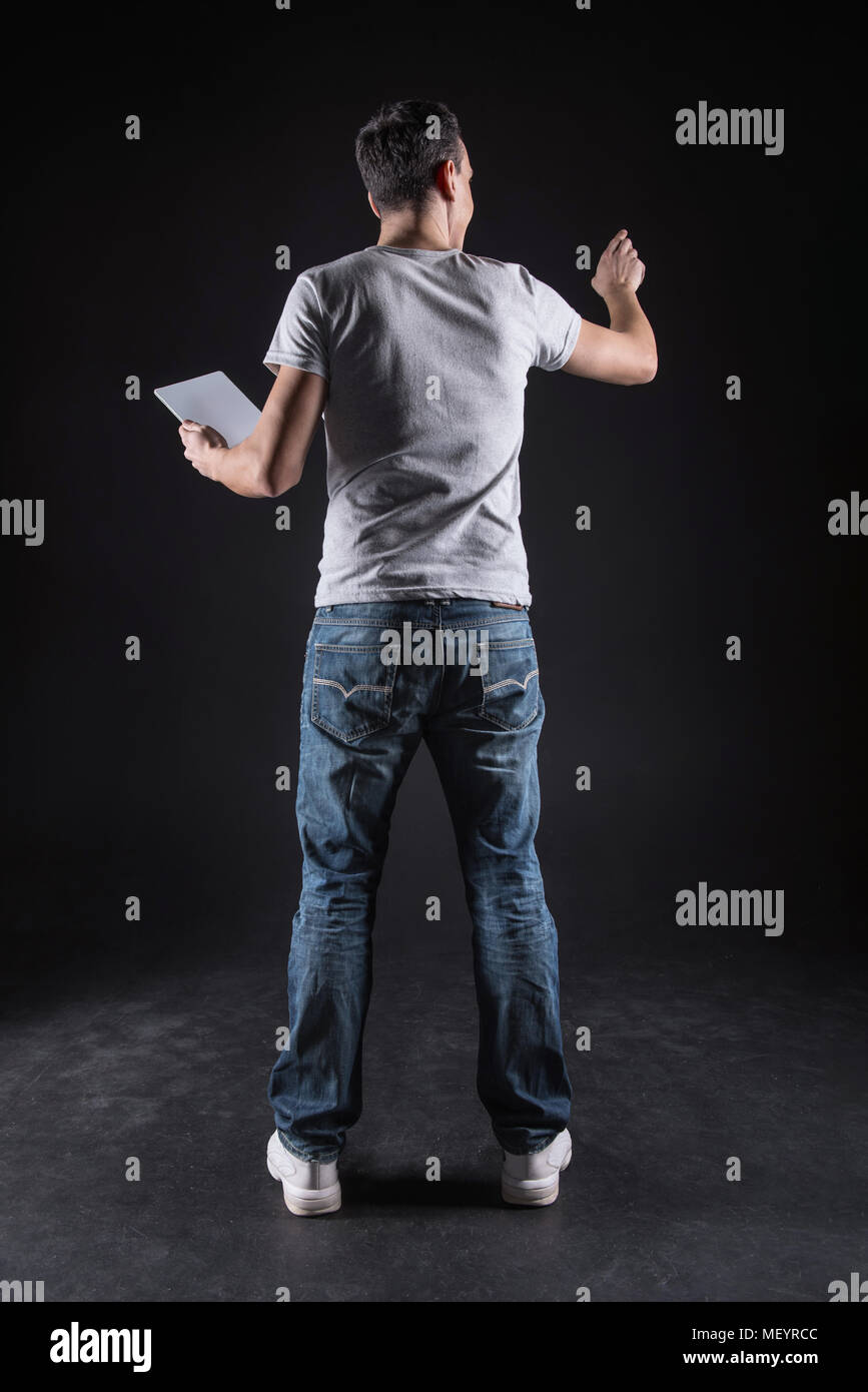 Confident smart programmer working on a sensory panel Stock Photo - Alamy
