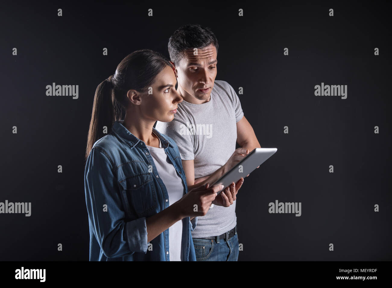 Smart young woman standing hi-res stock photography and images - Alamy