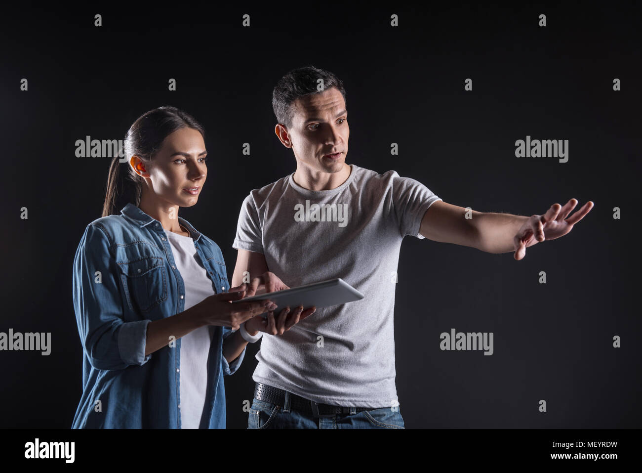 Intelligent nice people testing new technologies Stock Photo - Alamy