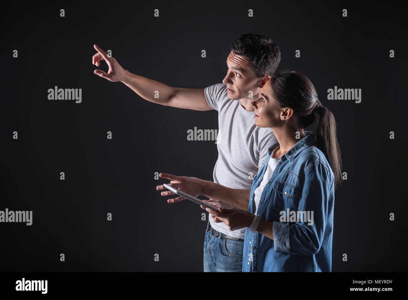 Nice intelligent man speaking with his female colleague Stock Photo - Alamy