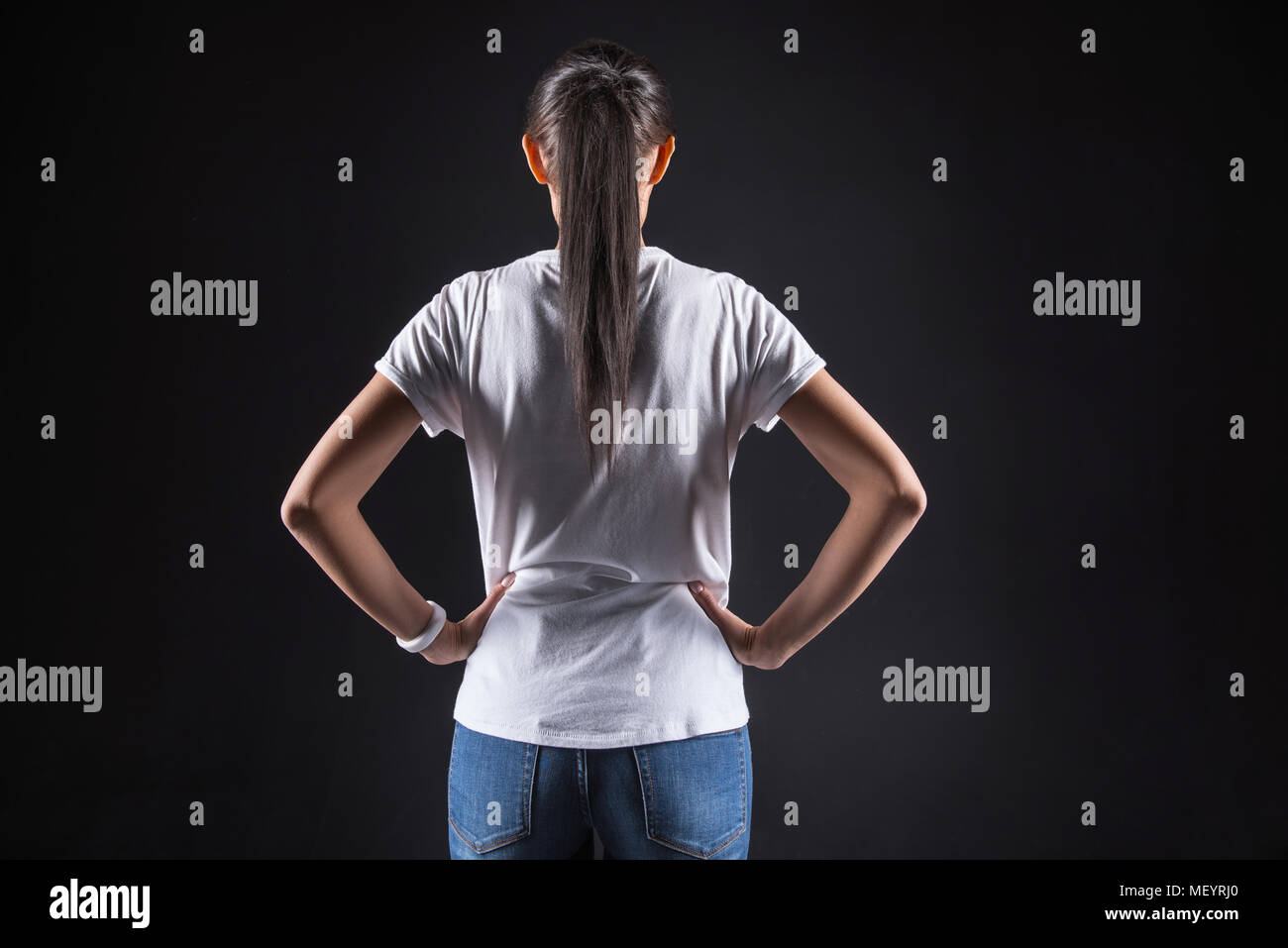 Smart condiment woman looking at the screen Stock Photo - Alamy