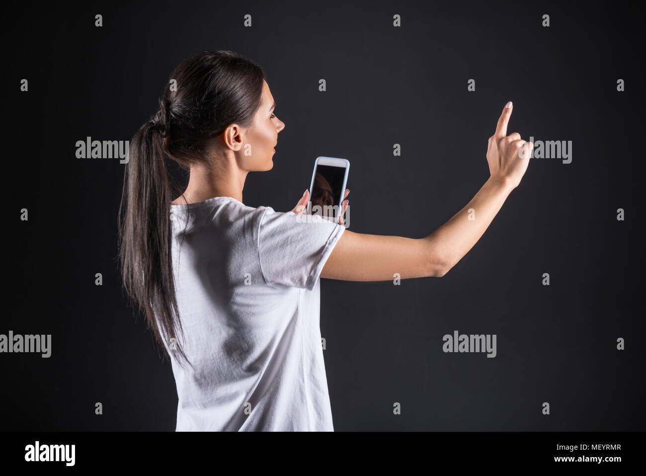 Cheerful delighted woman touching the sensory screen Stock Photo - Alamy Cheerful delighted woman touching the sensory screen Stock Photo - Alamy