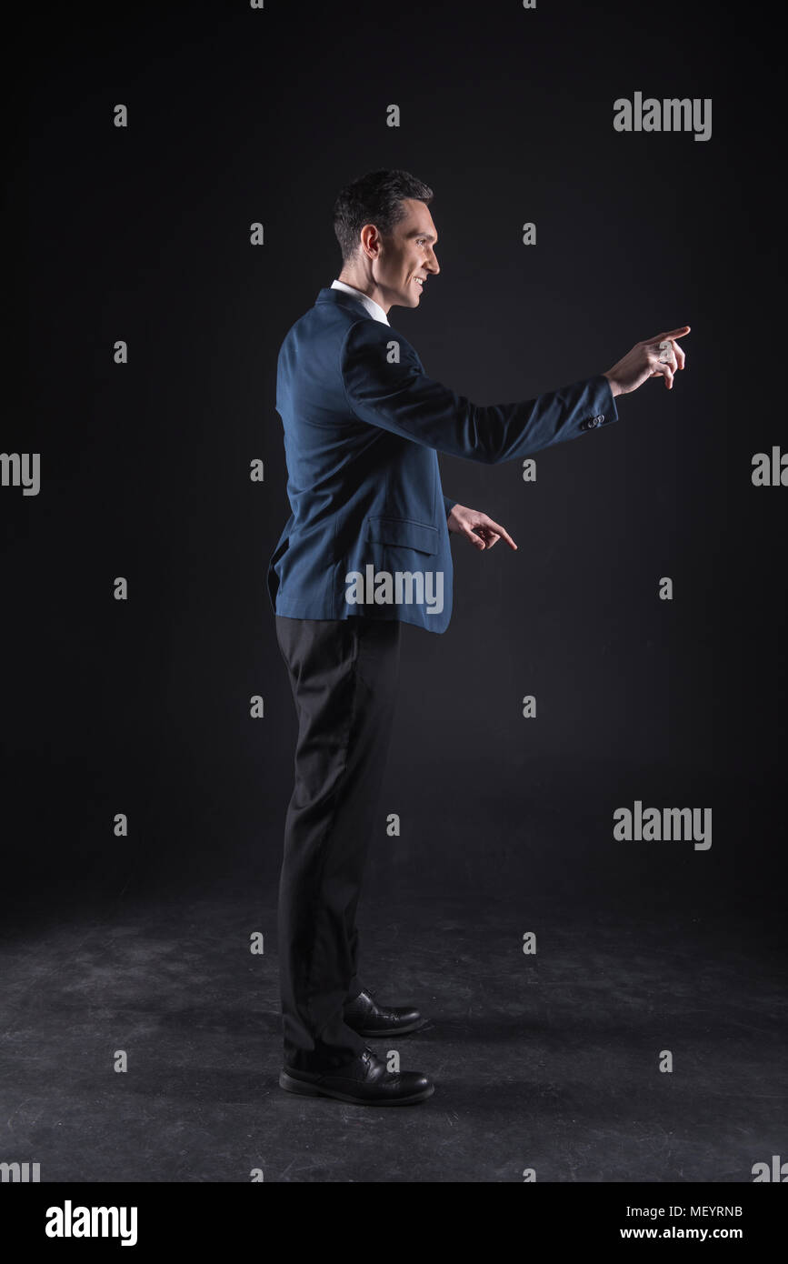 Delighted happy businessman using modern technology Stock Photo - Alamy