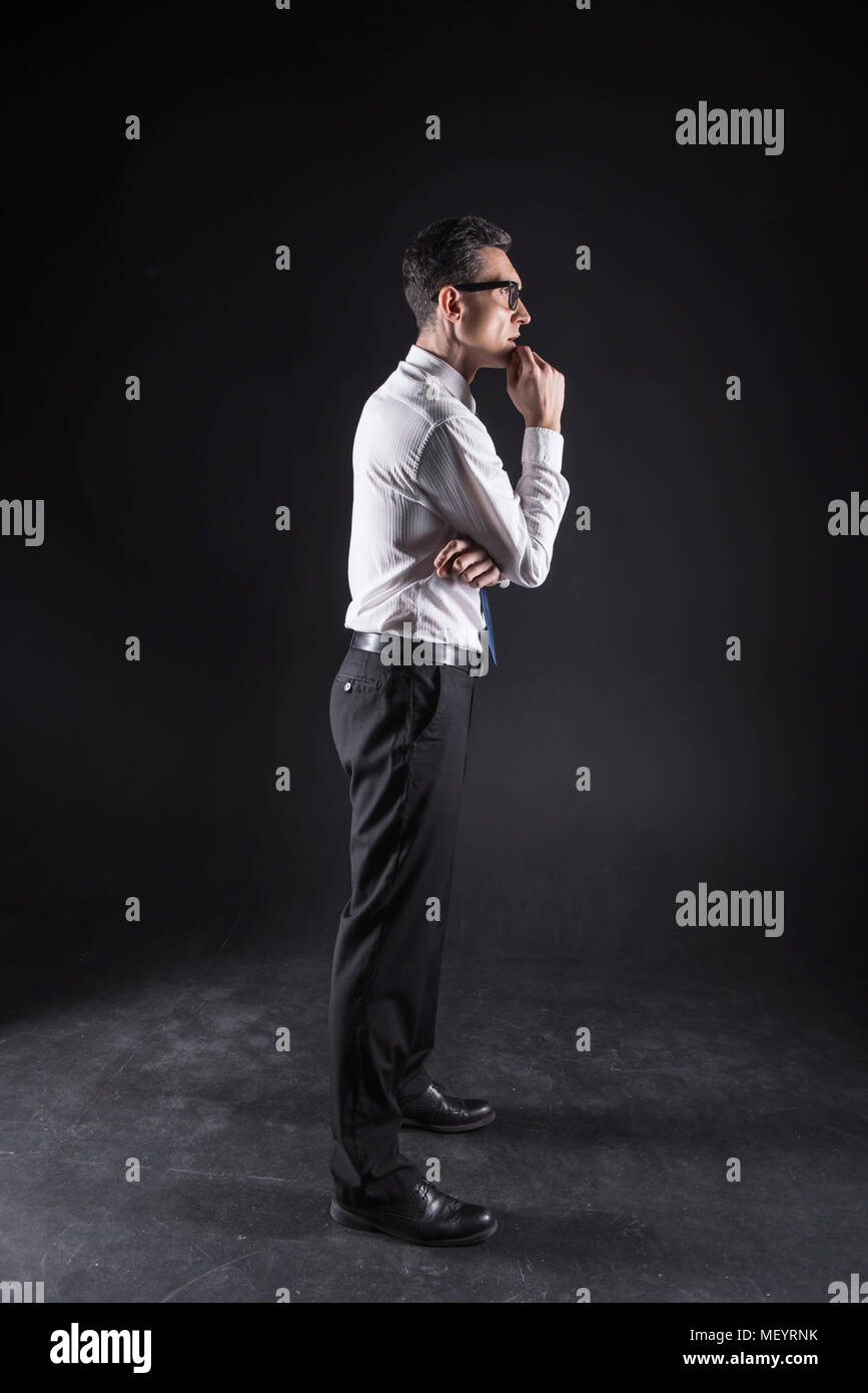 Nice smart man looking for a solution Stock Photo - Alamy