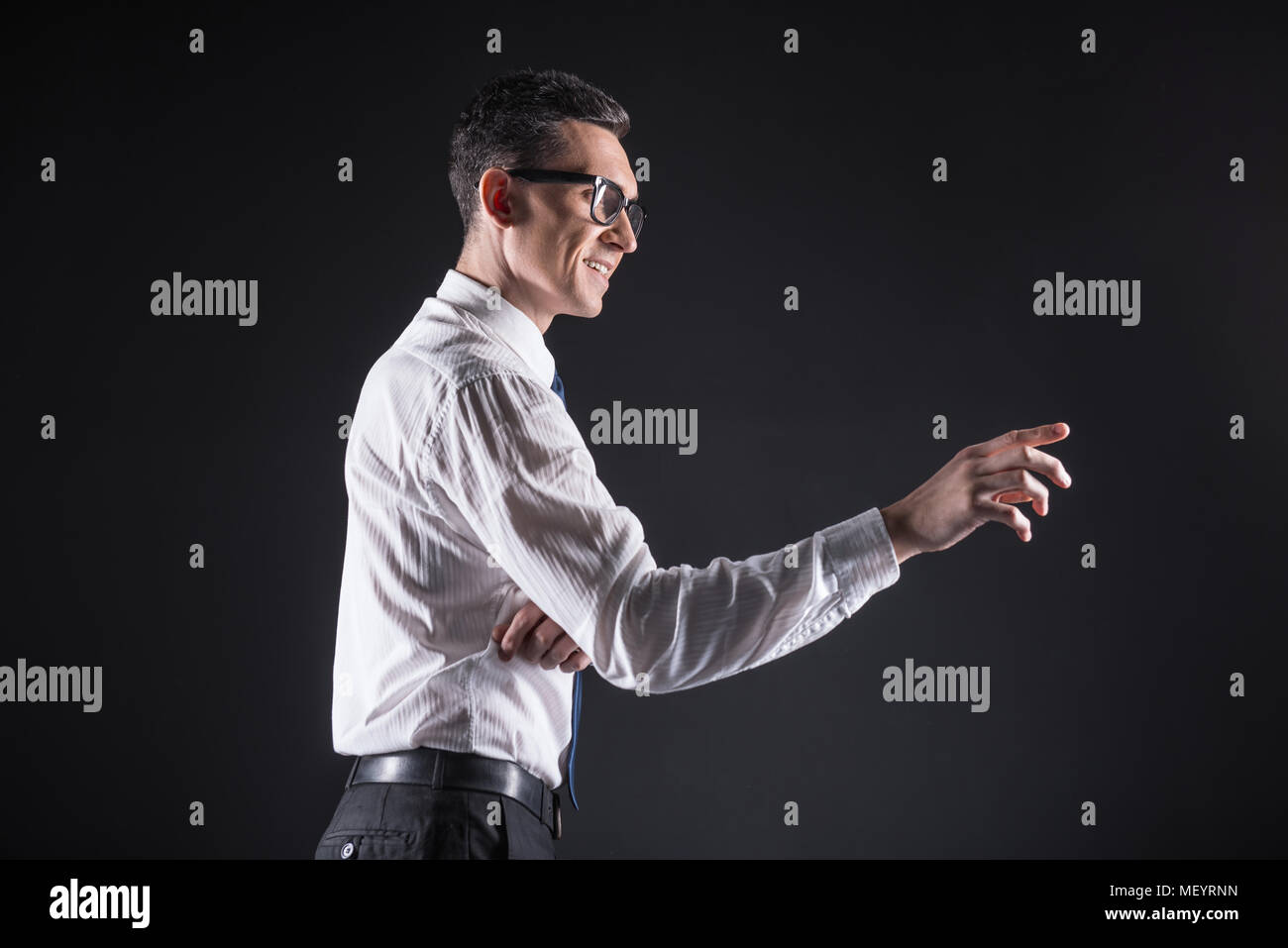 Happy male model using virtual hi-res stock photography and images - Alamy