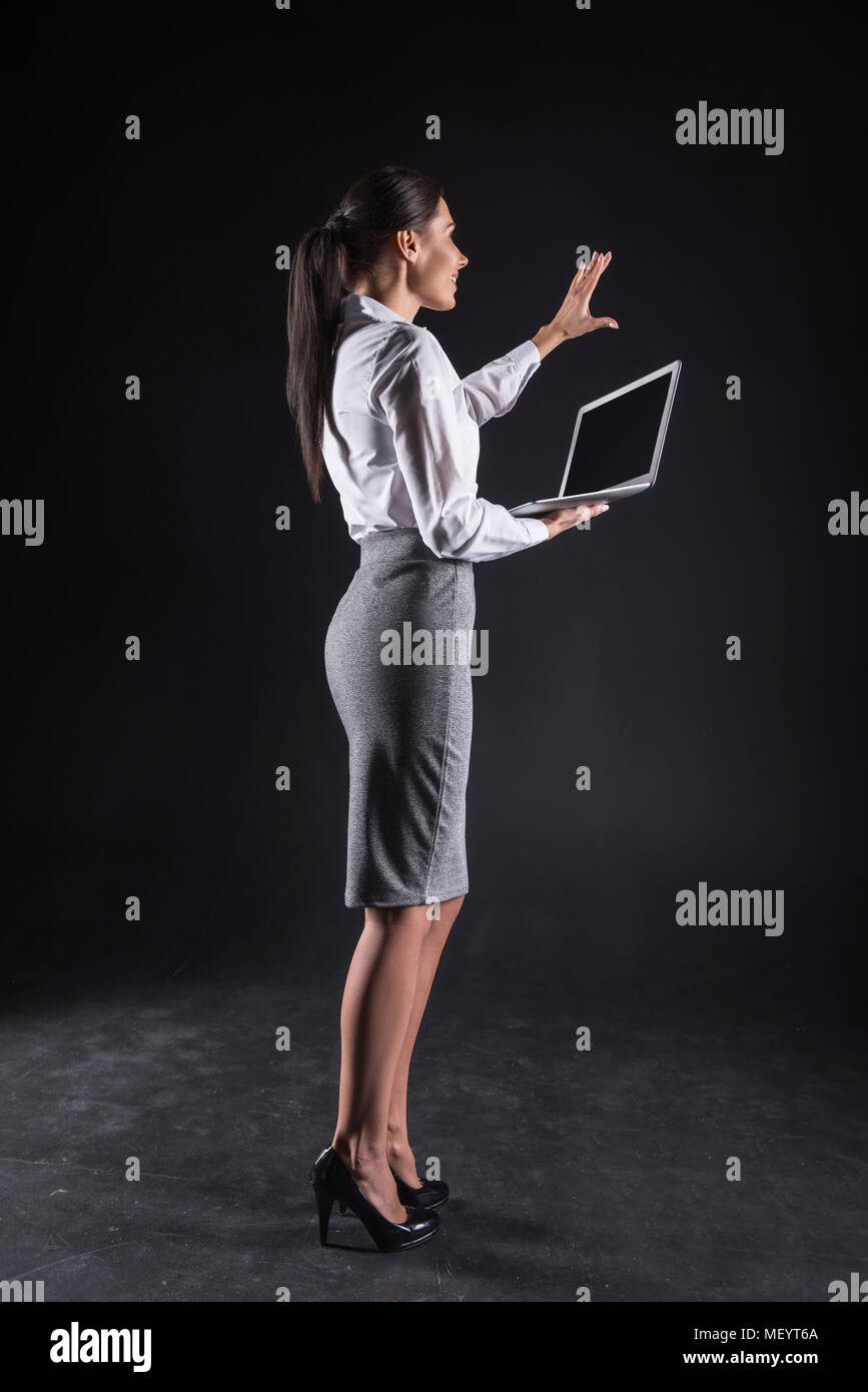 Nice professional businesswoman looking at the sensory screen Stock ...