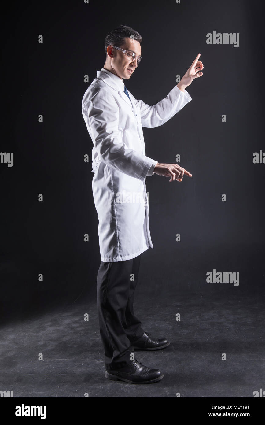 Handsome professional scientist pressing the button Stock Photo - Alamy