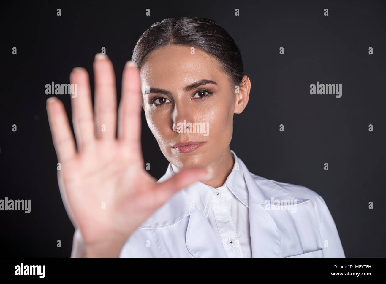 Nice young woman looking at you Stock Photo - Alamy
