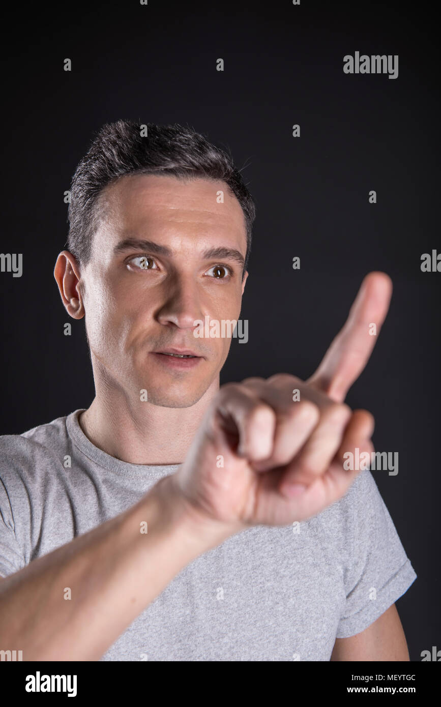 Nice smart man using his finger Stock Photo - Alamy