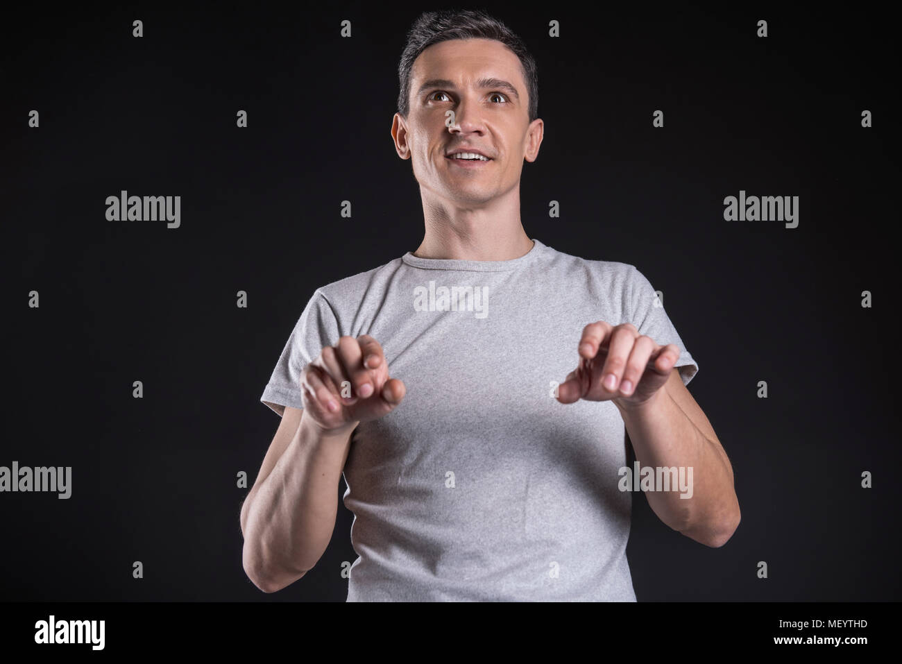 Smart cheerful programmer typing on the keyboard Stock Photo - Alamy