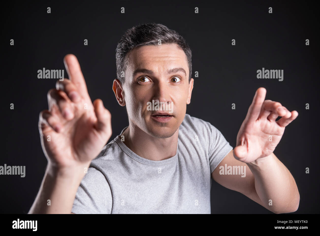 Portrait of a nice man looking at the tablet screen Stock Photo - Alamy