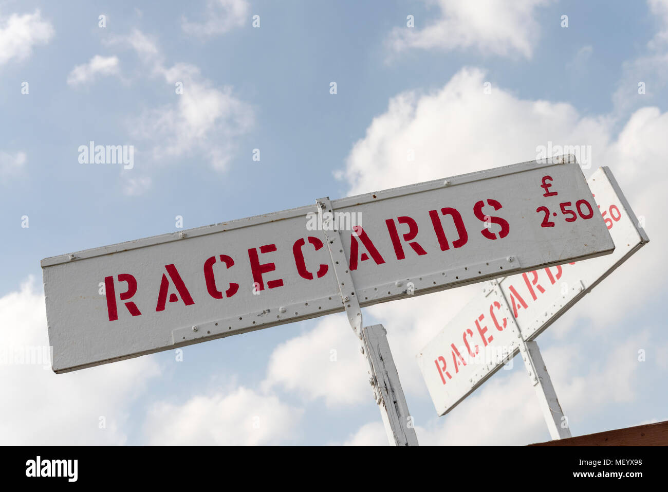 Racecard sign at a UK racecourse advertising racecards for sale Stock ...