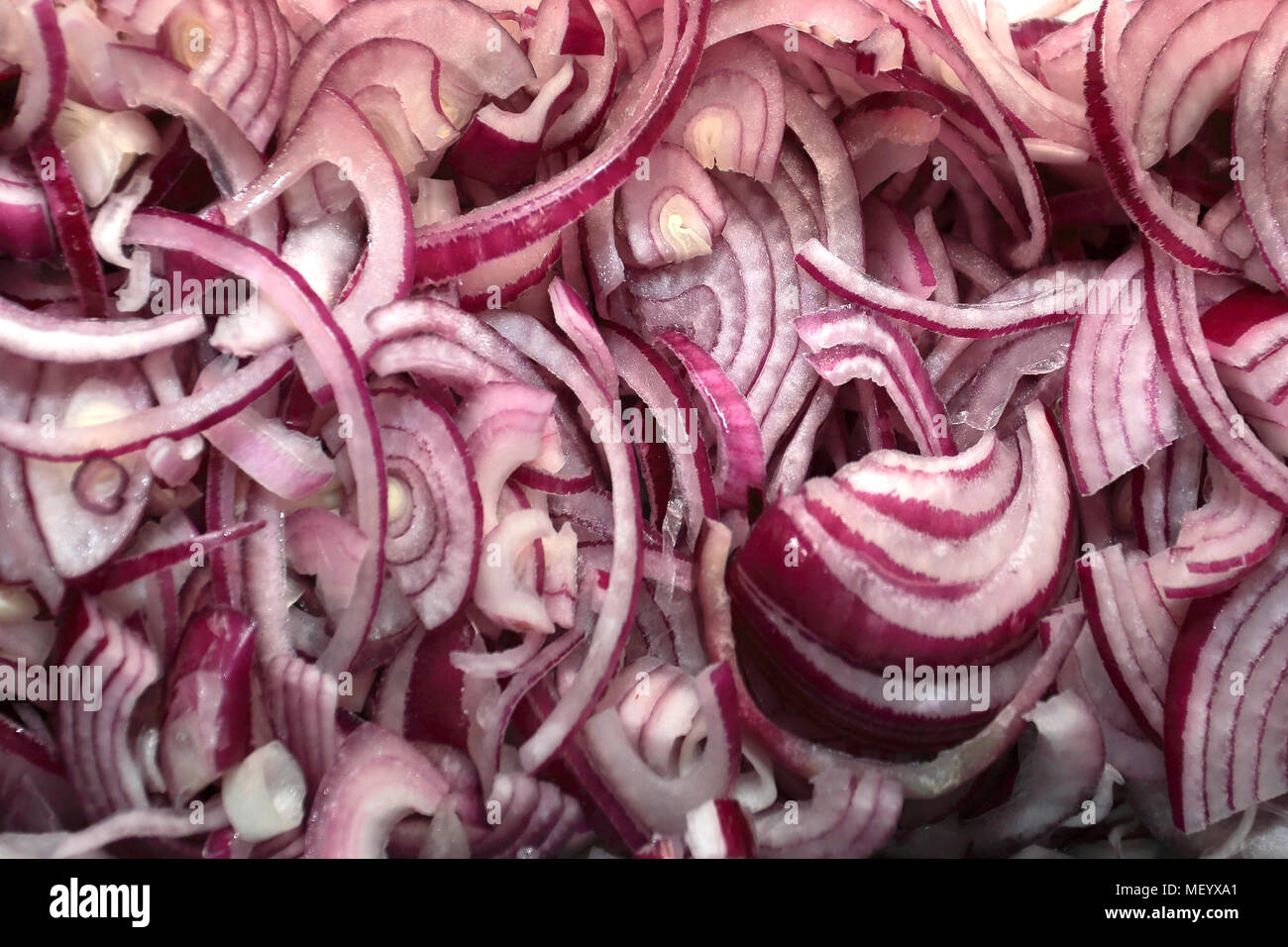 Cut red onions ready to be used as ingredients in cooking Pizzas Stock ...