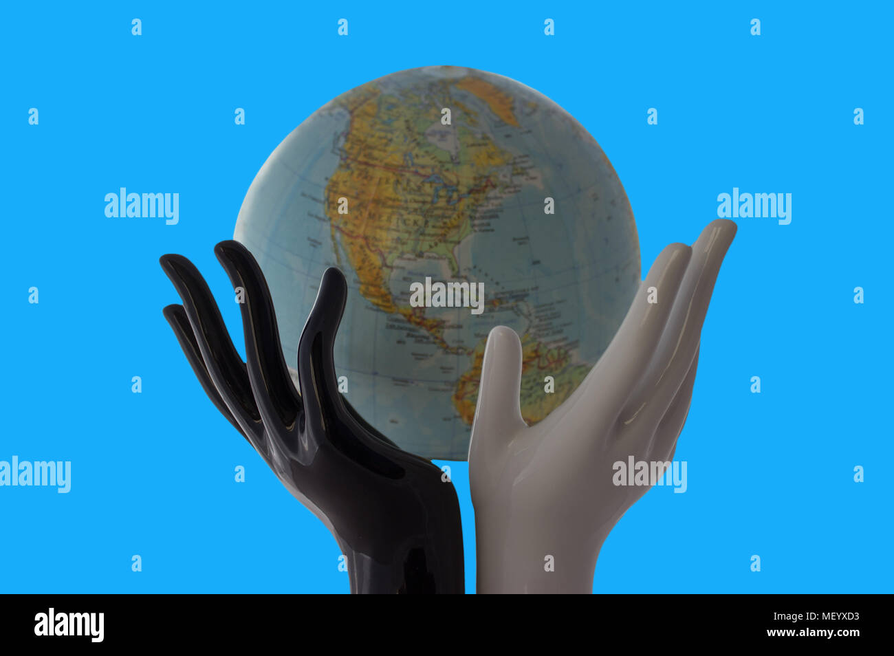 Symbol of peace and cooperation. Hands support globe on blue background ...