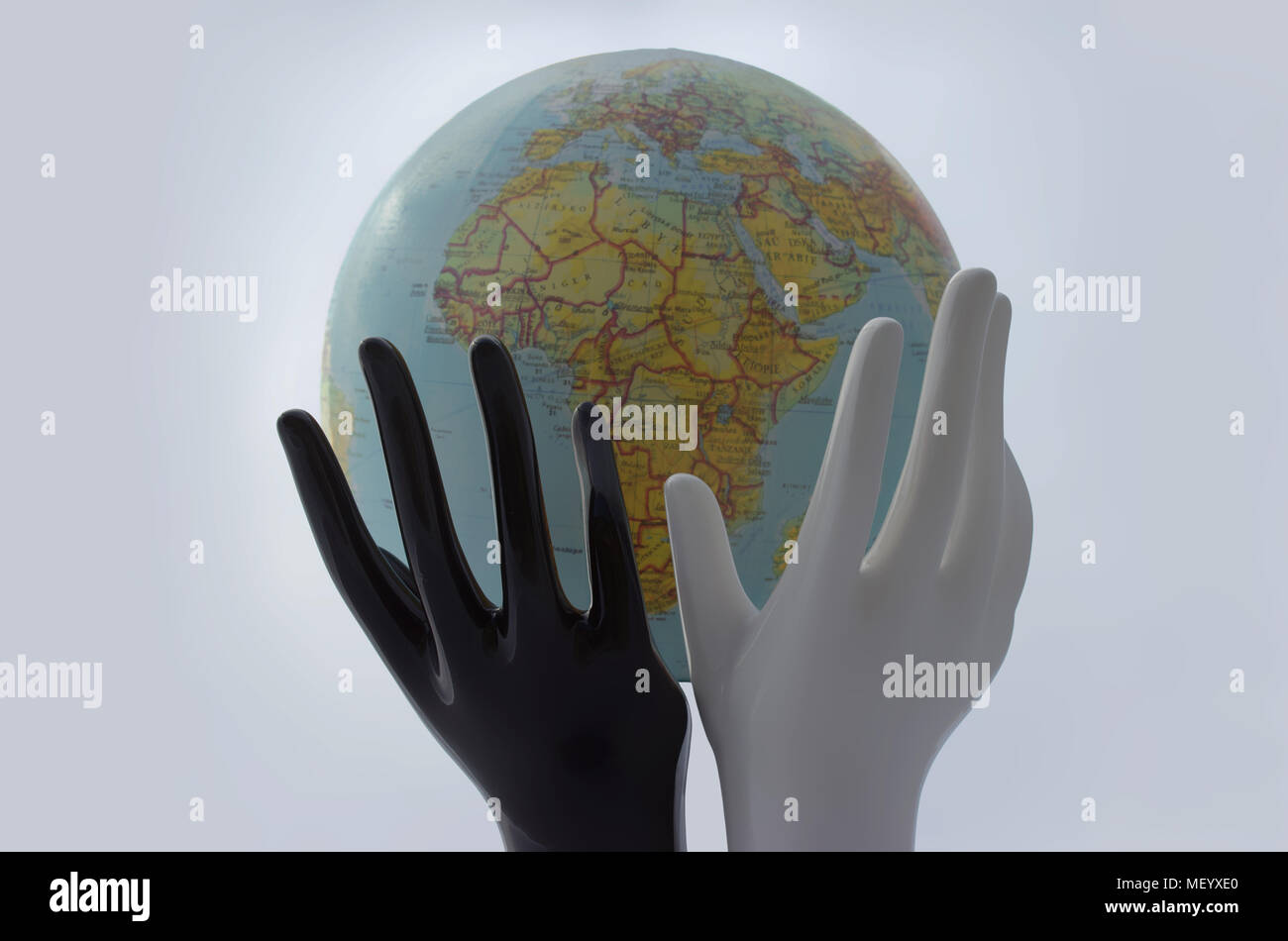 Symbol of peace and cooperation. Hands support globe on white ...