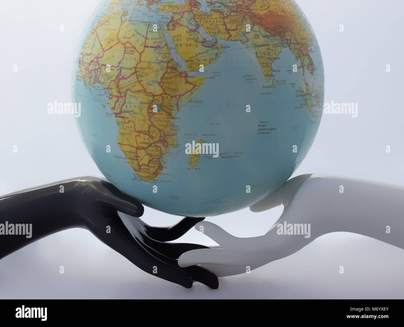 Symbol of peace and cooperation. United hands support globe Stock Photo ...