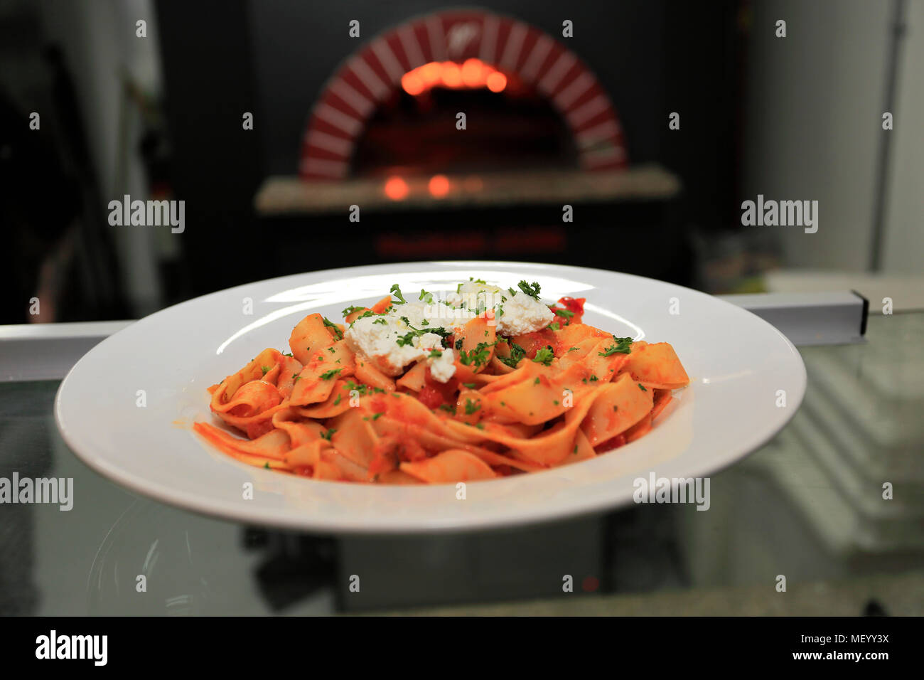 Tomato Spaghetti pasta dish, in a restaurant setting Stock Photo - Alamy