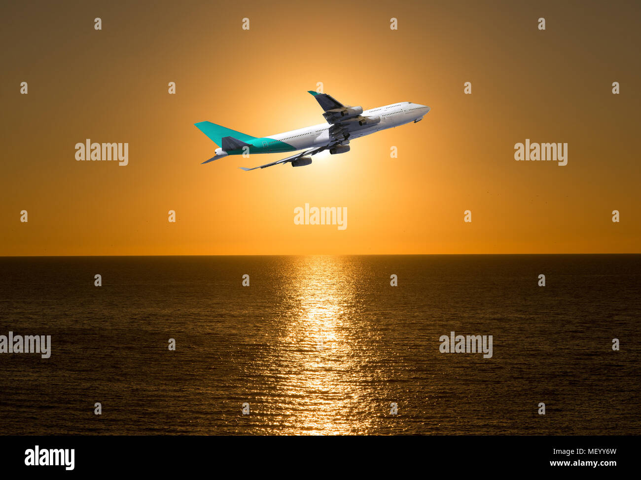 Airplane in sky sunset over ocean hi-res stock photography and images ...