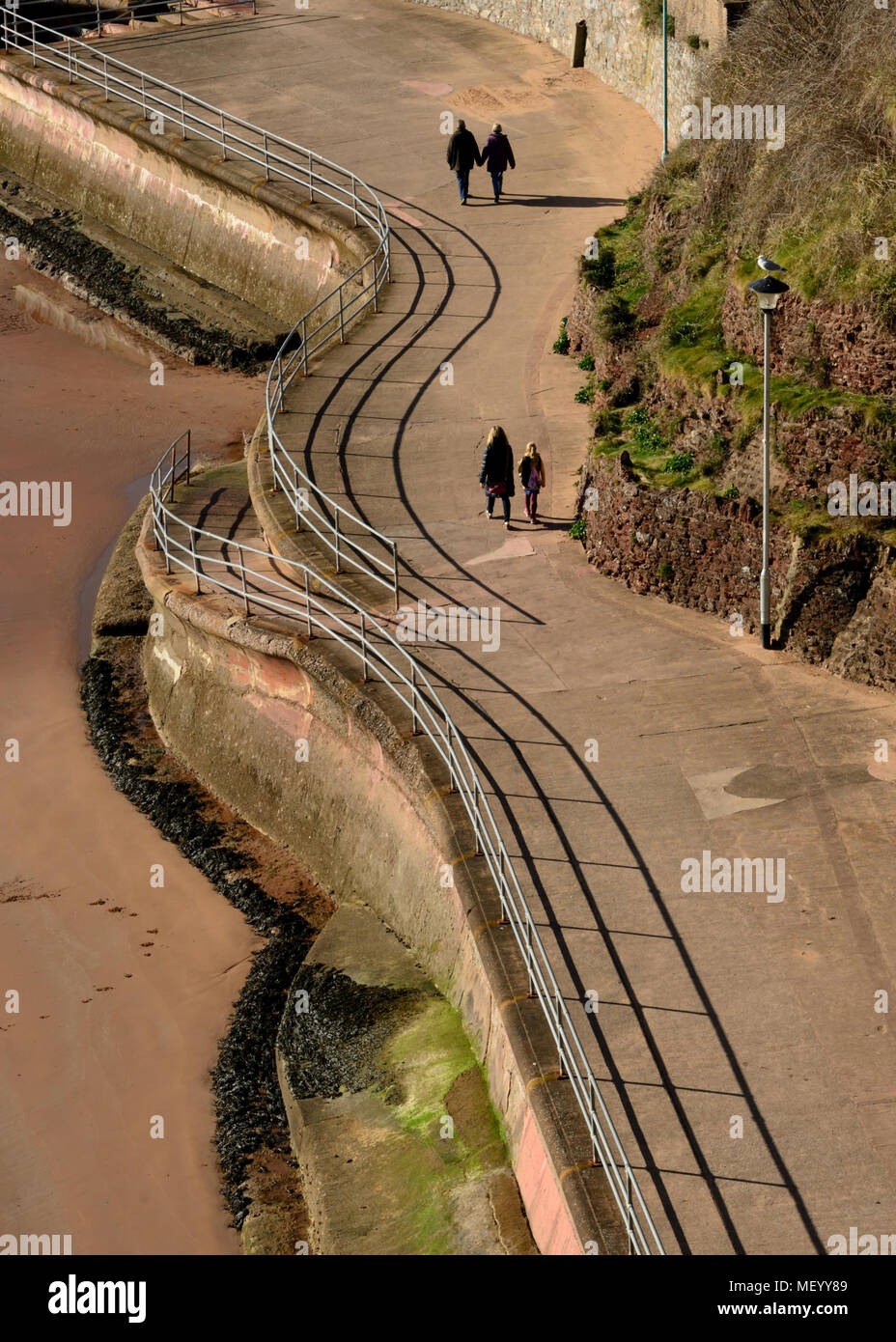 Seafront railings and shadows Stock Photo - Alamy