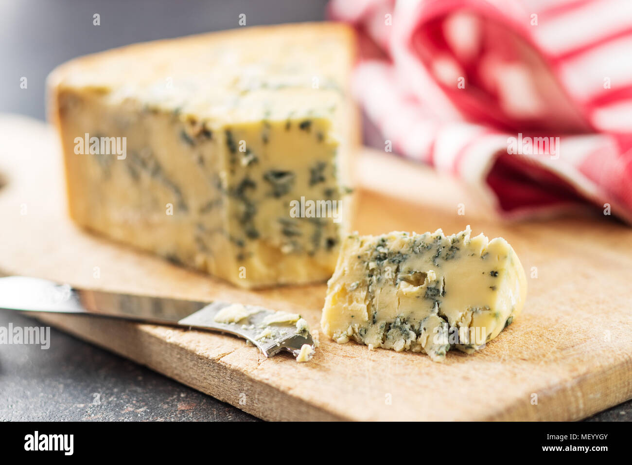 Tasty blue cheese on cutting board Stock Photo - Alamy