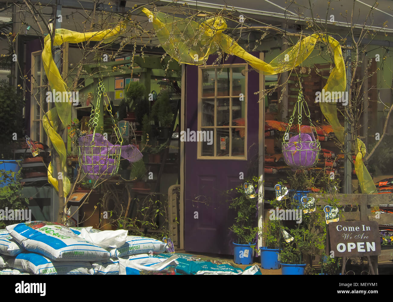 decorative yellow fabric draped over a garden shop entrance Stock Photo ...