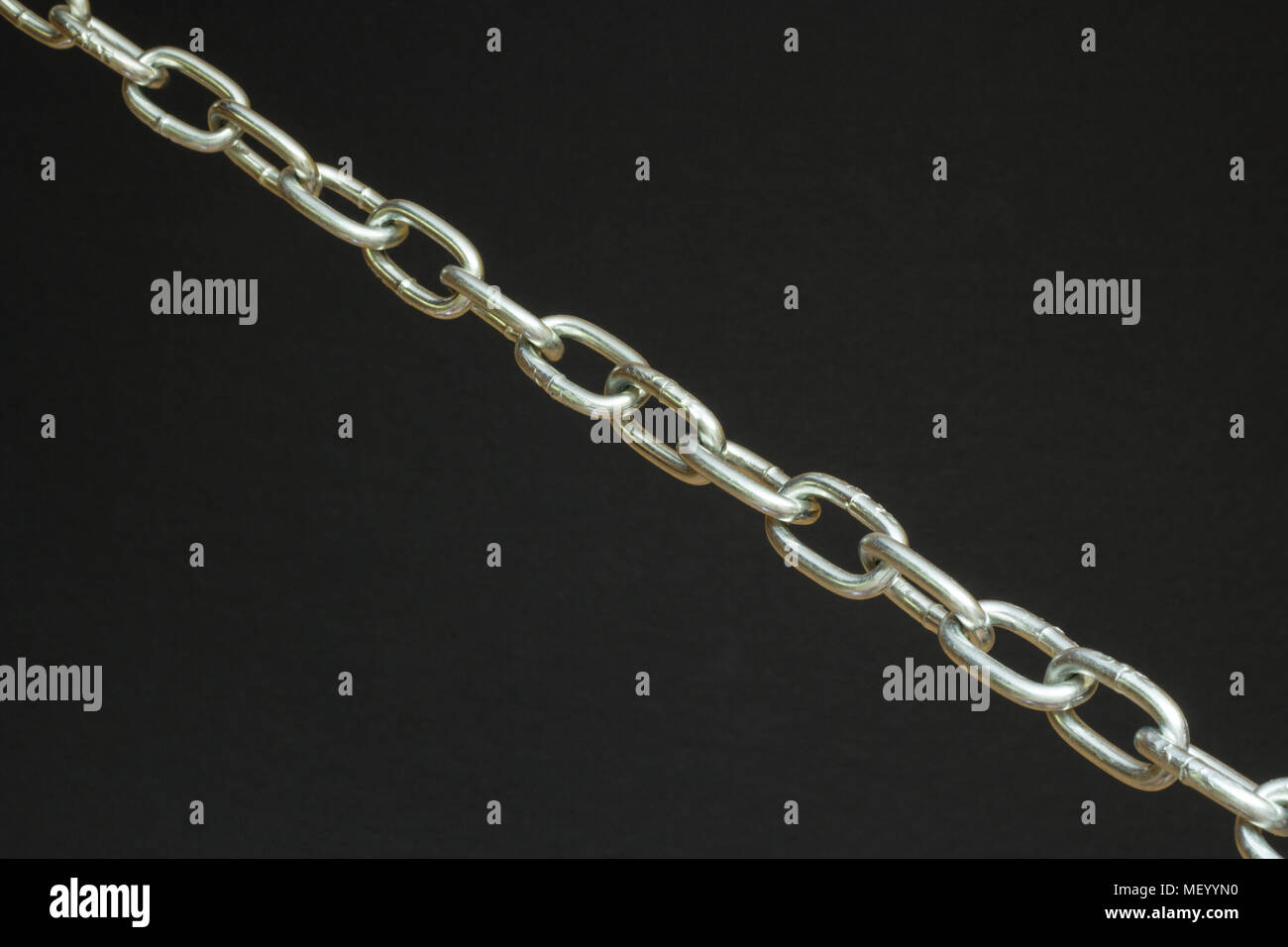Strong silver chain on black background concept Stock Photo - Alamy