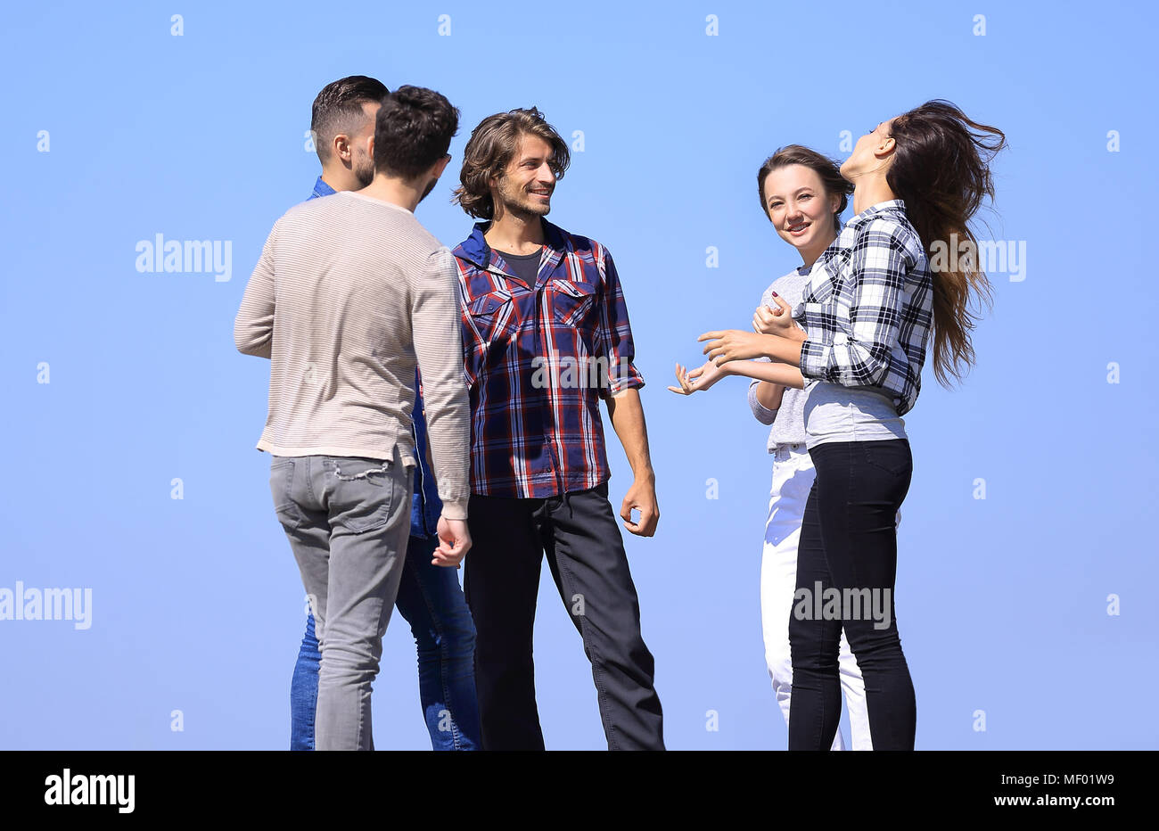 group of students talking while standing outdoors Stock Photo - Alamy