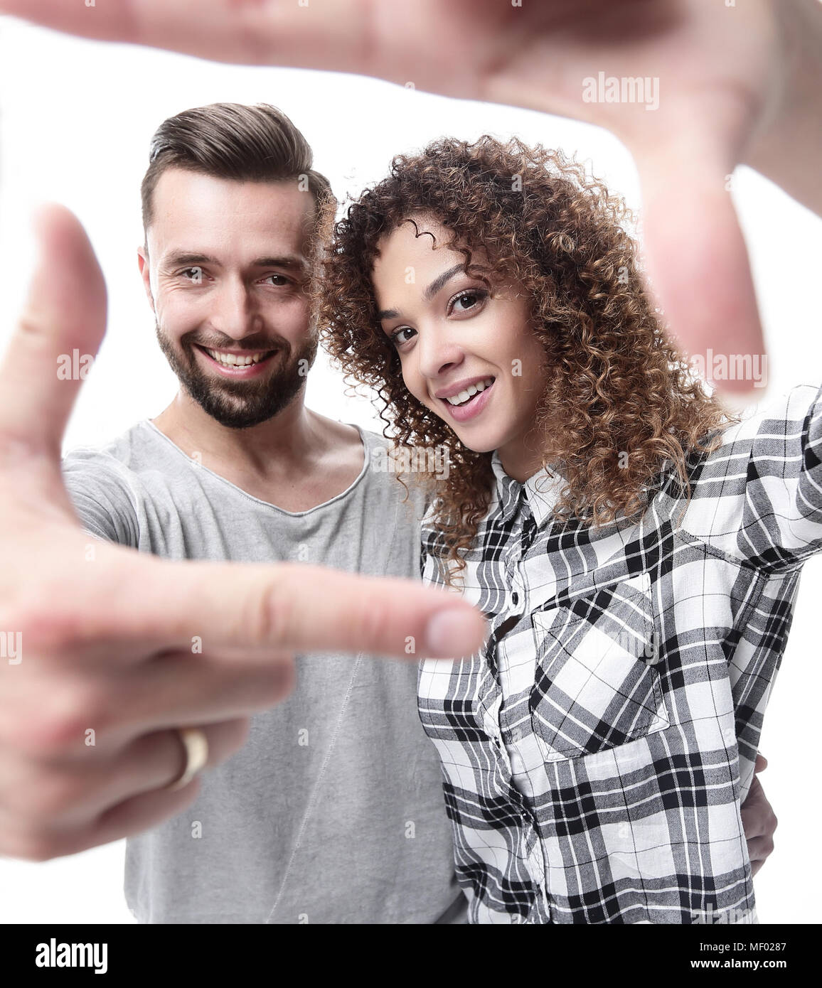 newlyweds look in the frame of the fingers Stock Photo - Alamy