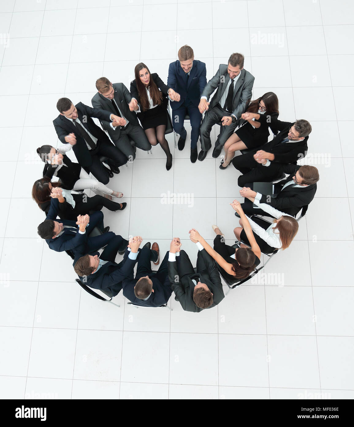 concept of team building.large business team sitting in a circle Stock ...