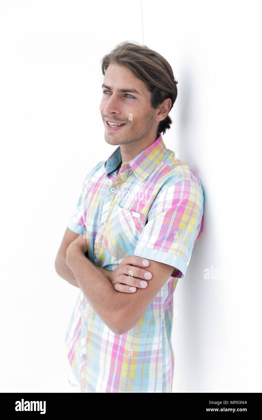 modern guy leaning on wall and looking forward Stock Photo - Alamy