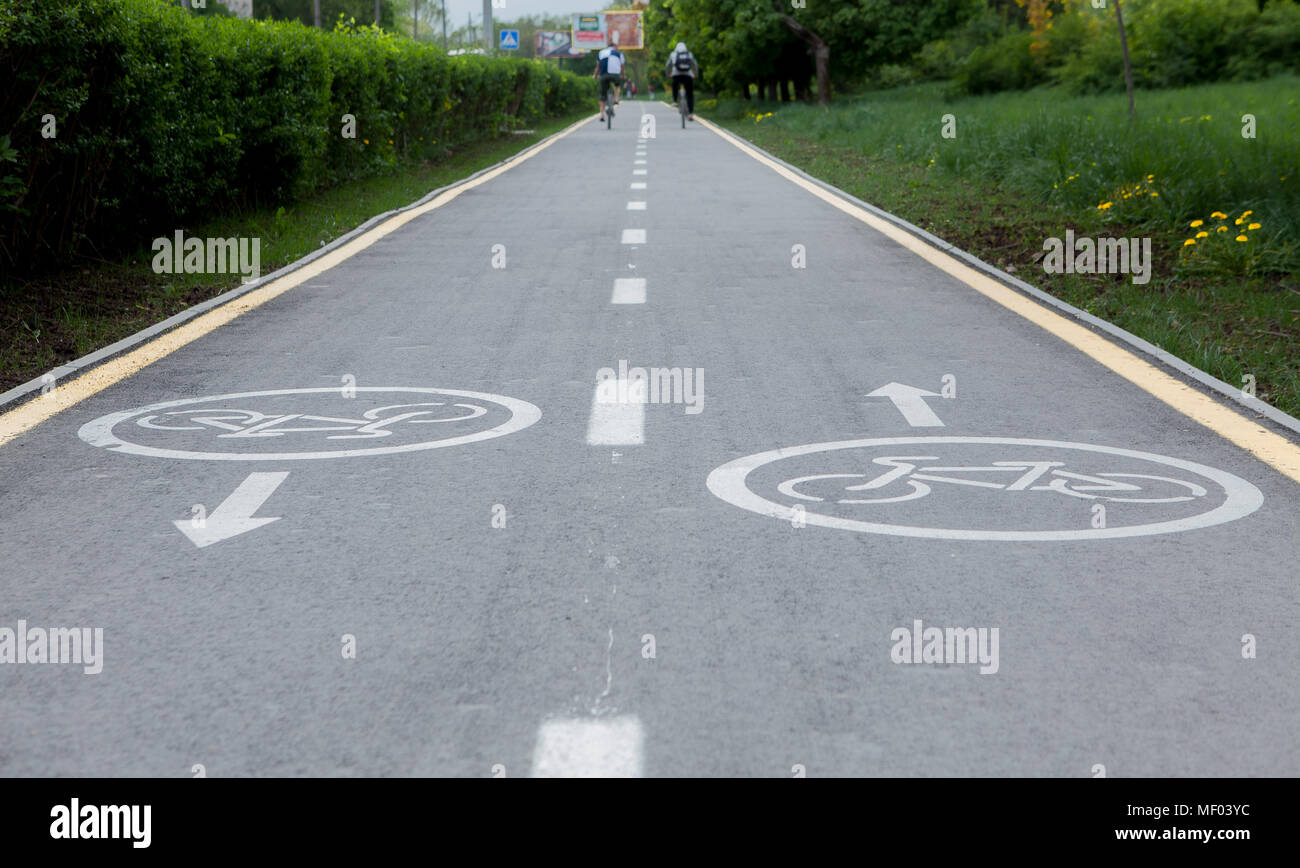 Painted signs on asphalt for bicycle dedicated lanes. A separate bike ...